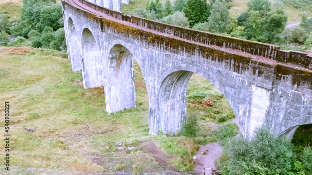 Tilt down shot to the iconic Glenfinnan Viaduct. Famous movie scene ...