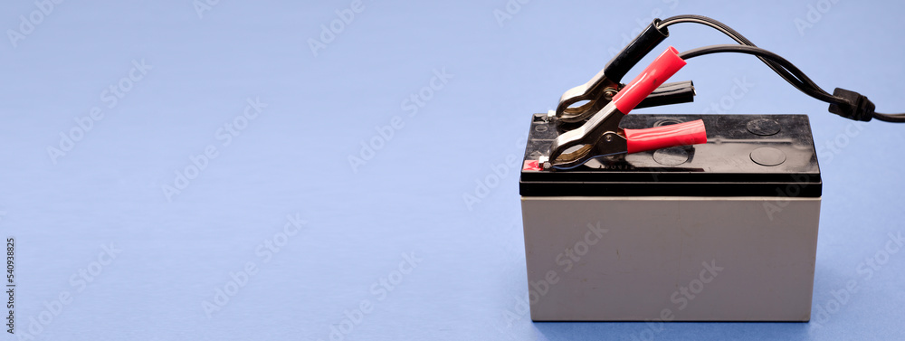 connected bolts charging positive pole and negative pole of battery ...