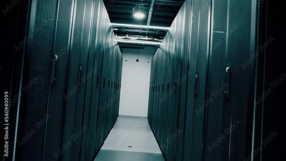 Camera moves through big working data center with server racks . Real ...