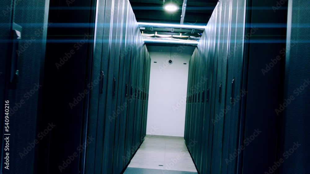 Camera moves through big working data center with server racks . Real ...