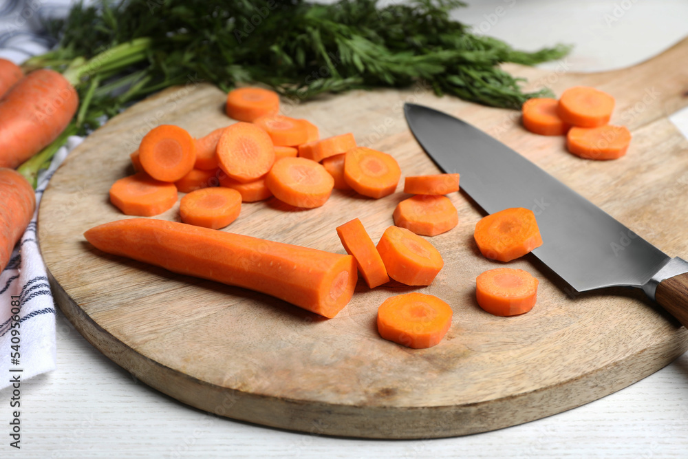 Sliced fresh ripe juicy carrots on white table Stock Photo | Adobe Stock