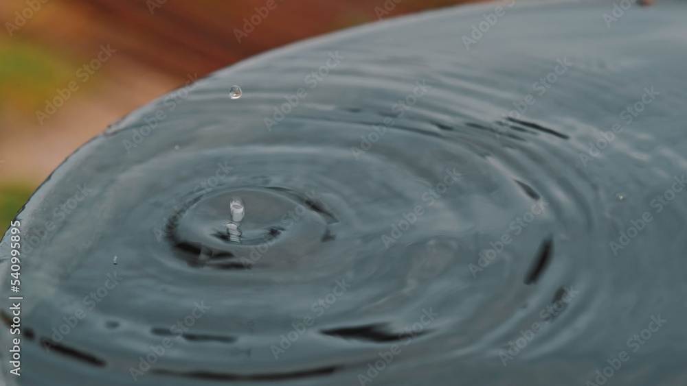 Raindrops Water Splashing Surface of Water in Overflowing Barrel ...
