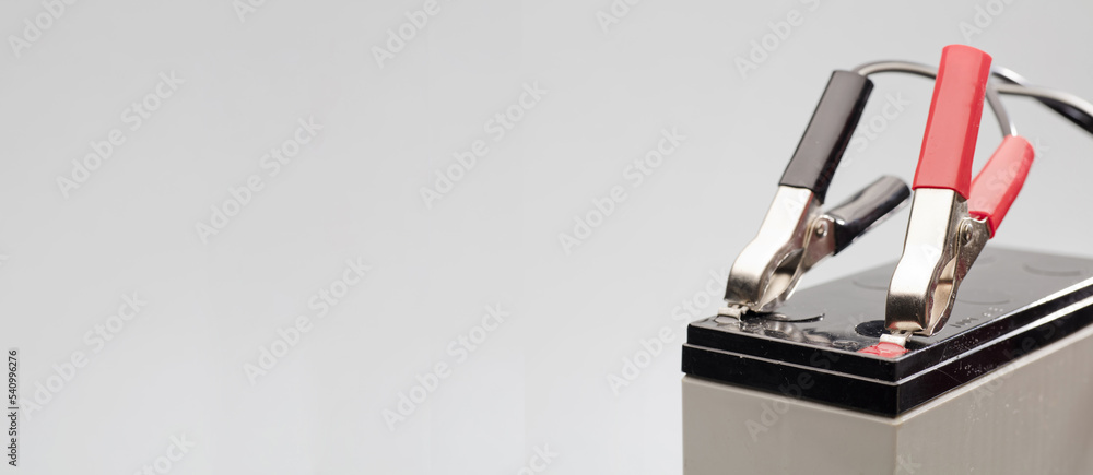 connected bolts charging positive pole and negative pole of battery ...