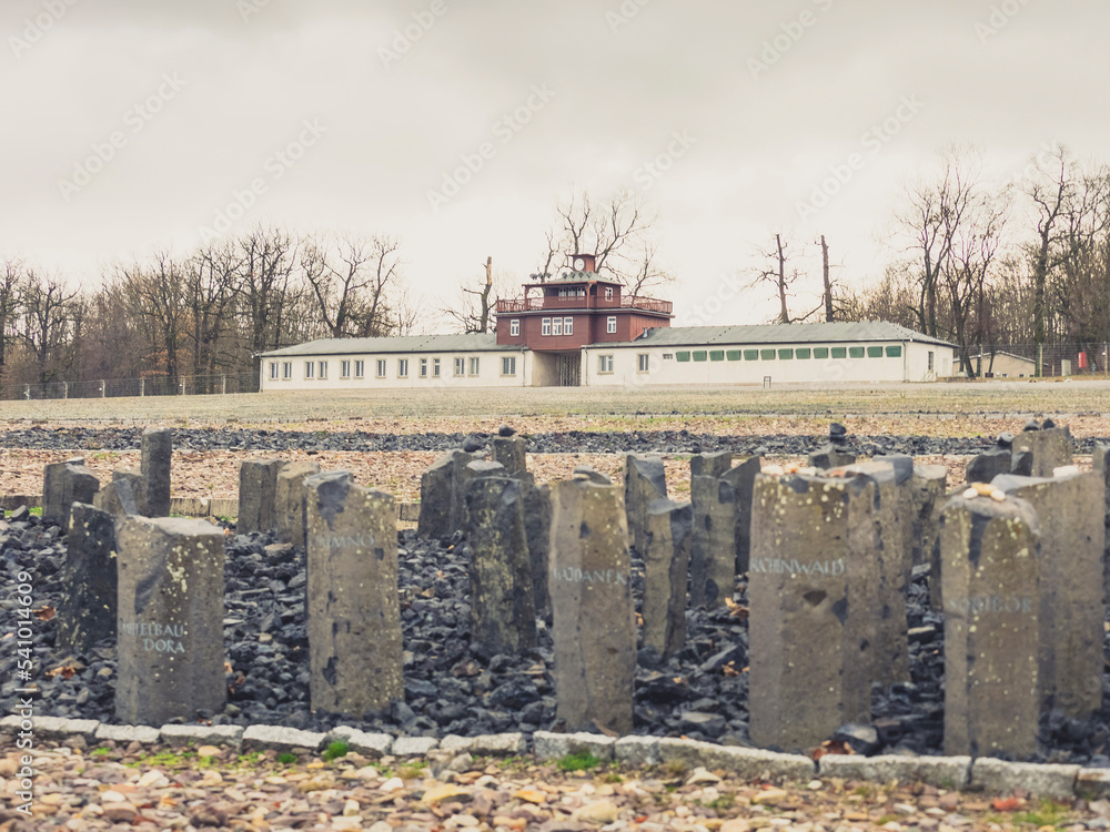 Black basalt steles and gate building with watchtower at concentration ...