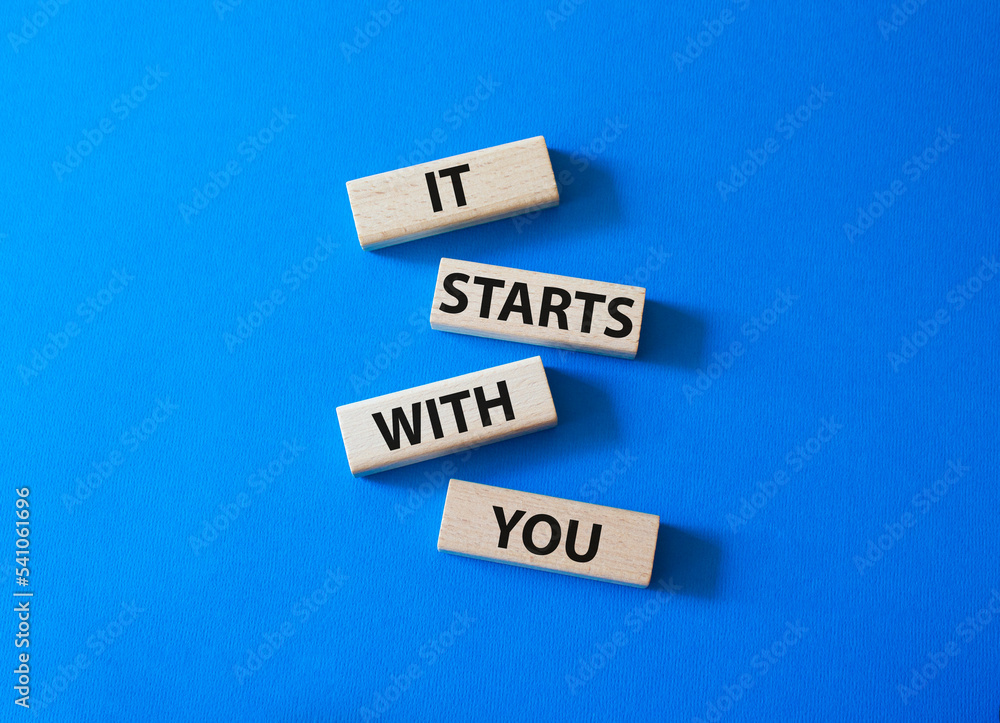 It starts with you symbol. Wooden blocks with words It starts with you ...
