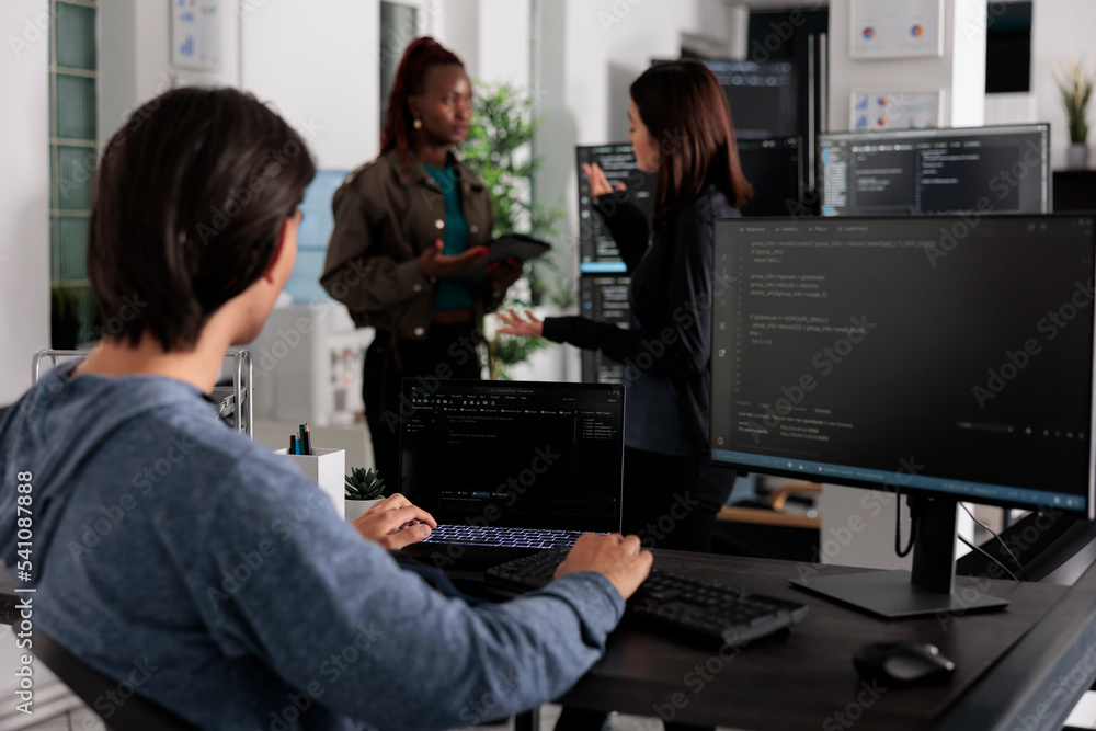 Asian Web Developer Analyzing Compiling Code Looking At Computer And Laptop Working On New App