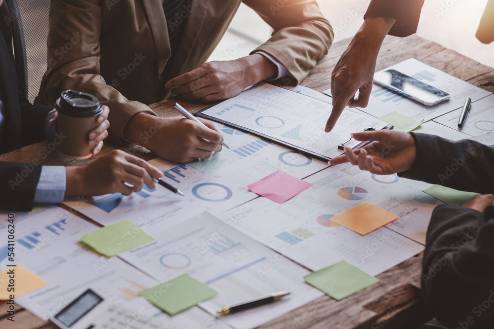 Business People Meeting using chart graph calculator, laptop computer ...