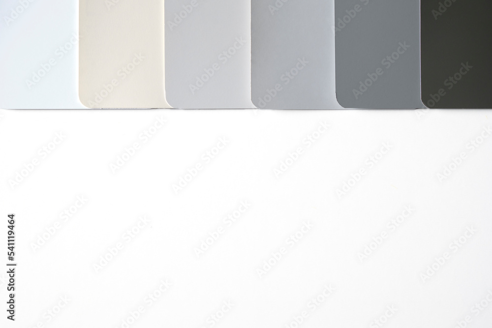 Color sample cards in shades of white through grey to almost black ...