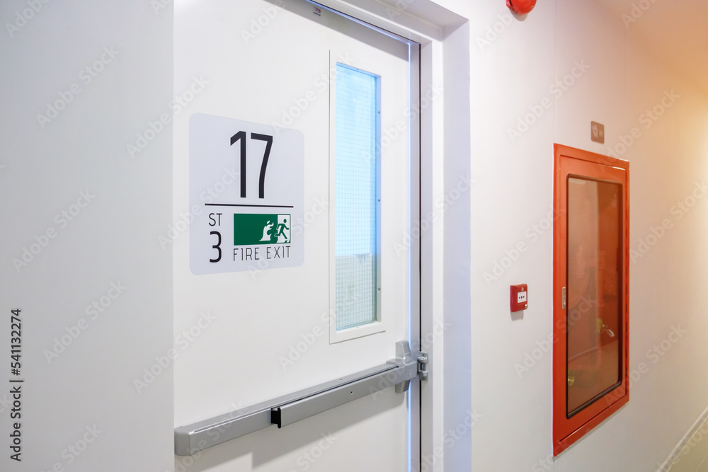 Poster Fire extinguisher system on the wall with Fire Exit door sign ...