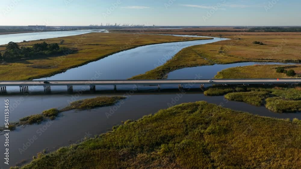 Southern USA marsh bog lowcountry. Aerial of bridge and traffic driving ...