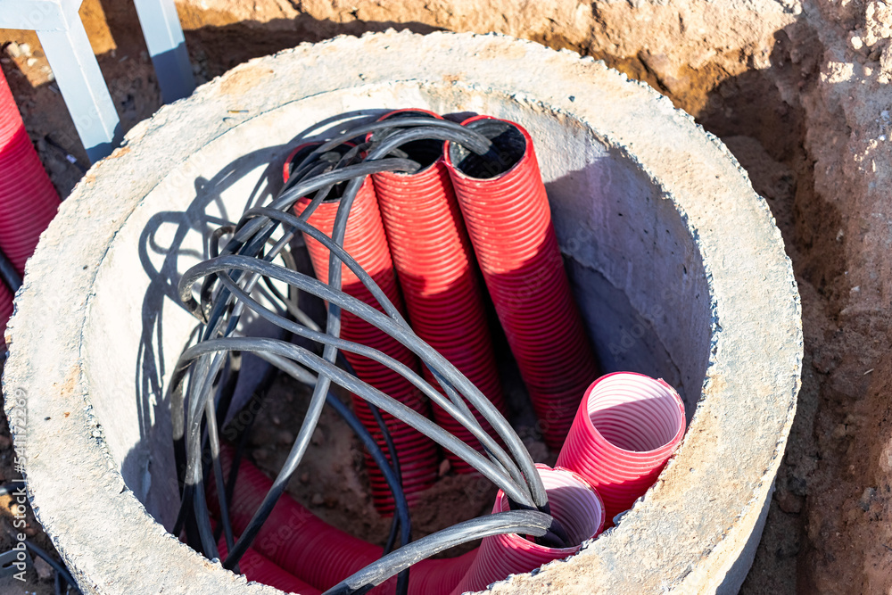 The ends of the electrical cable in the trench. electrical cable ...