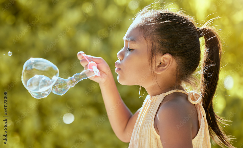 Child, bubbles and nature park with asian kid outdoor on vacation in a ...