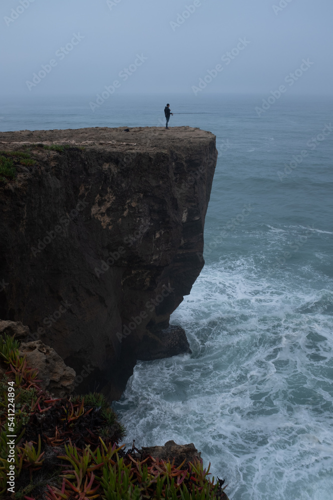 person on the cliff Stock Photo | Adobe Stock