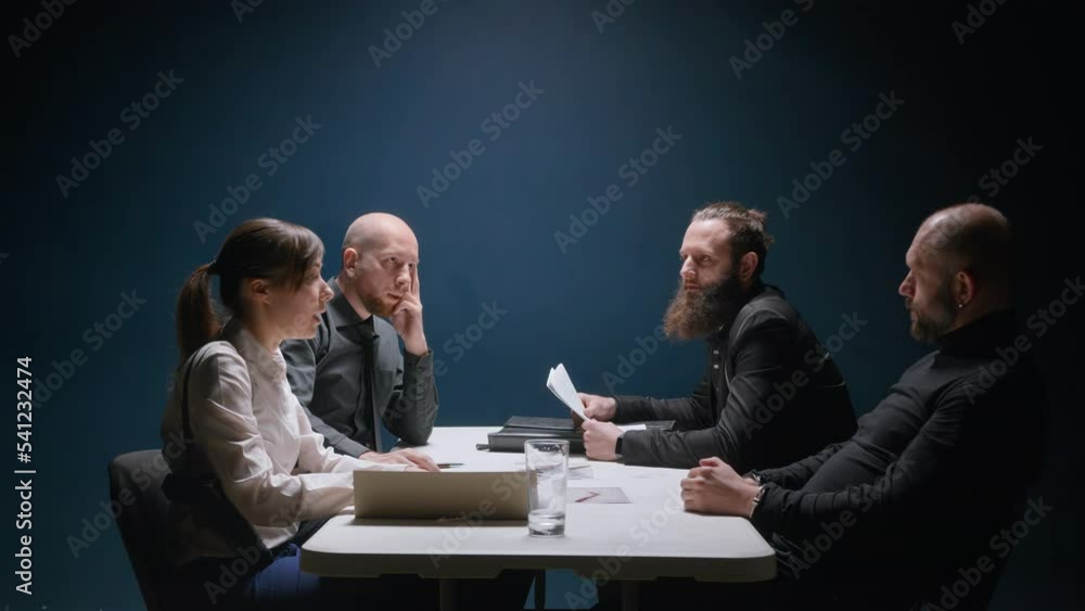 Two Police officers interrogate murder suspect in handcuffs. Lawyer ...