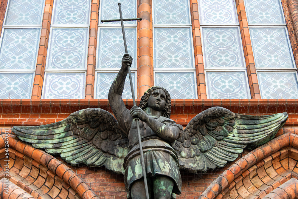 Statue of Archangel Michael killing the snake, Christian church ...