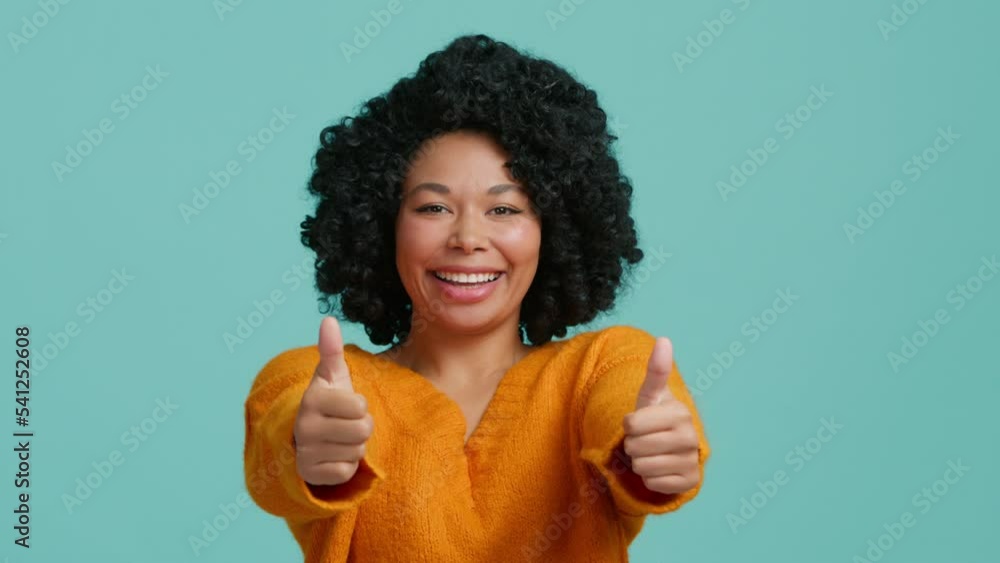 Cheerful Charming beautiful African American positive woman showing ...