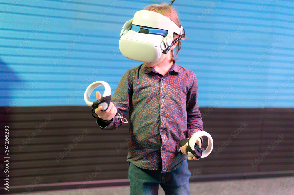 vr game and virtual reality. kid boy gamer six years old fun playing on ...