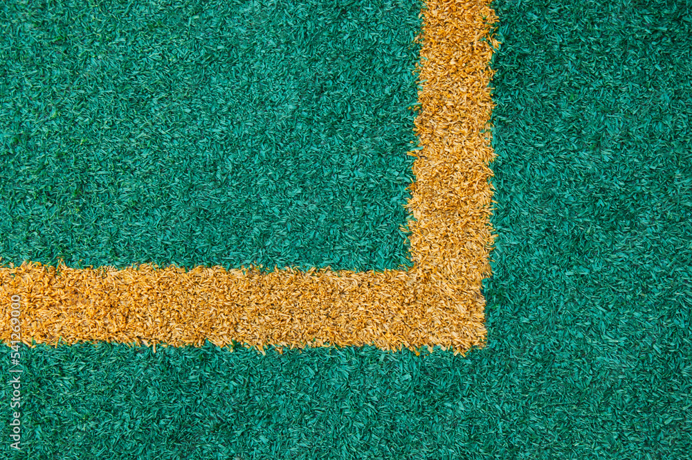 yellow markings on the green football field. football game concept ...