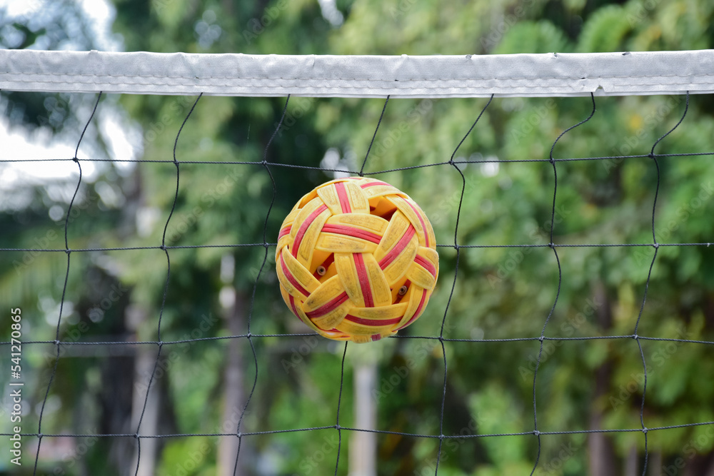 Sepak takraw ball on net, soft and selective focus on ball, outdoor ...