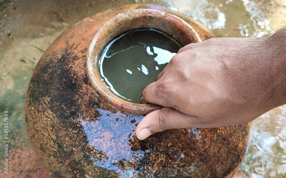 Ethiopian woman hand collecting and lifting old traditional round ...