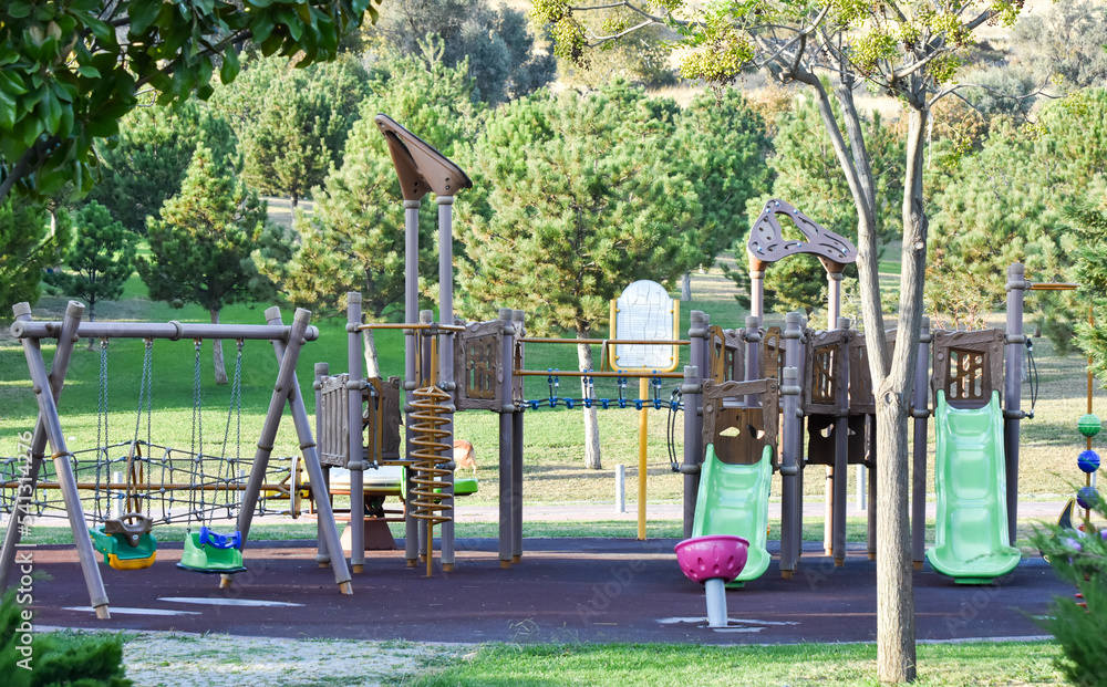 Beautiful playground in a park among trees Stock Photo | Adobe Stock