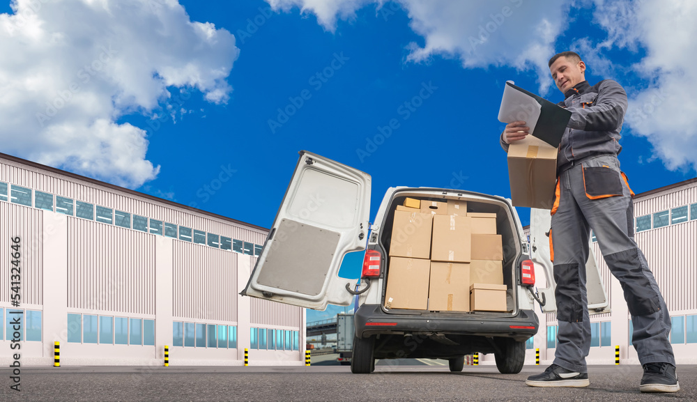 Postal worker. Minivan behind courier. Postman picks up boxes from ...