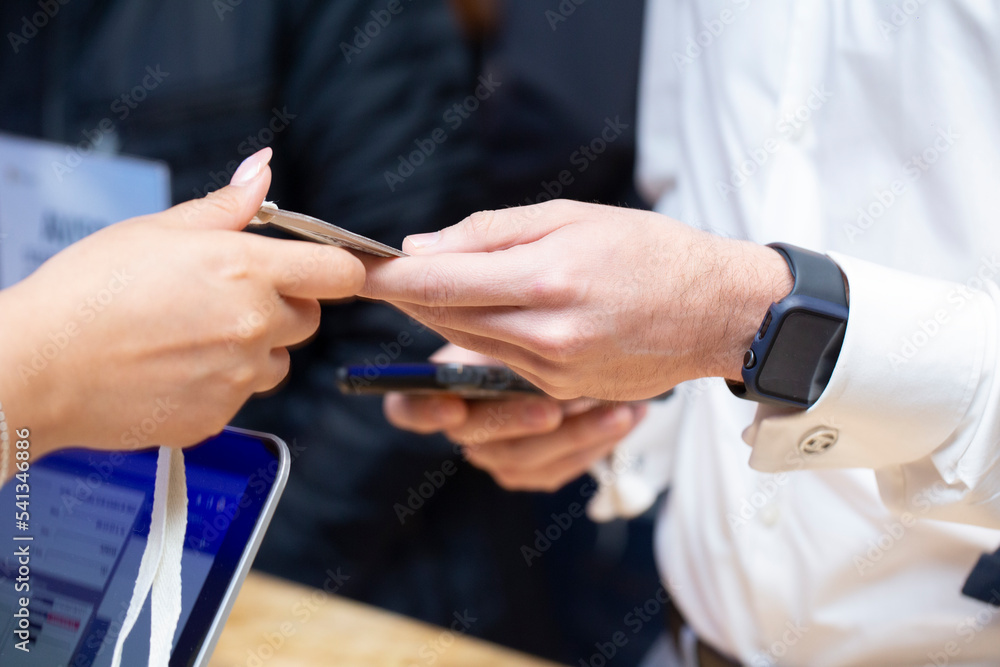 hands handing out welcome card at the reception desk Stock Photo ...