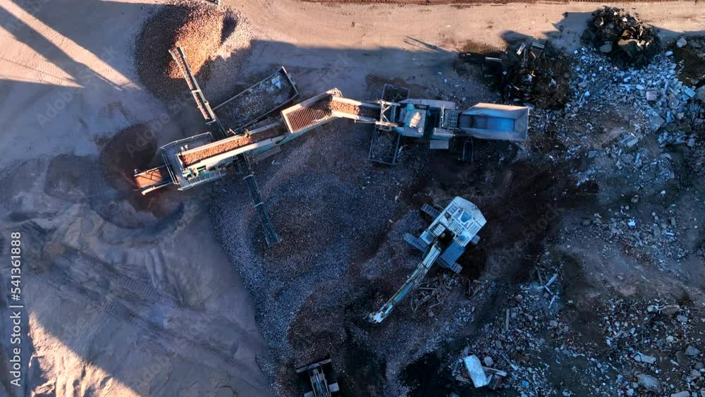 Concrete Recycling and asphalt from demolition. Excavator at landfill ...