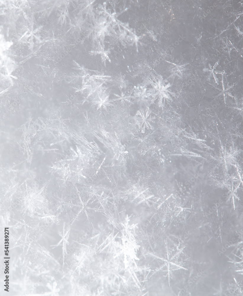 White snowflakes in winter as a background. Stock Photo | Adobe Stock