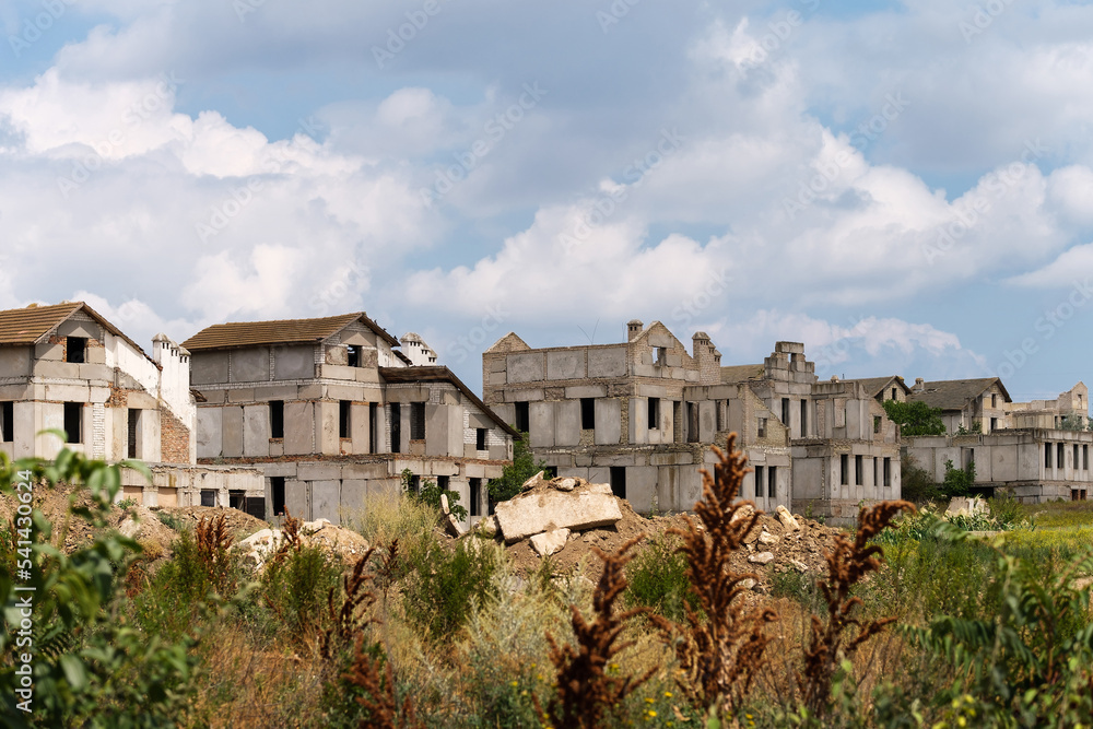 Row of abandoned houses, underdeveloped or ruined. Real estate broken ...