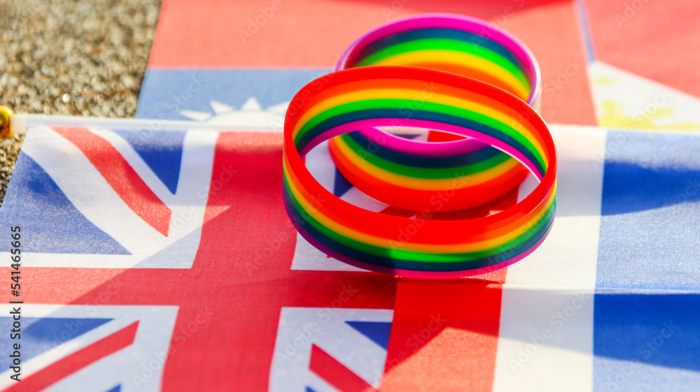 LGBTQ flag with countries flags are put on the floor with lgbt wrist ...