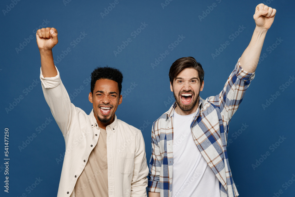 Young two friends overjoyed fun men wear white casual shirts together ...