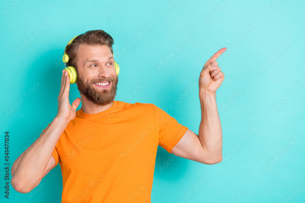Portrait Of Good Mood Guy With Blond Hairdo Wear Orange T Shirt Fingers