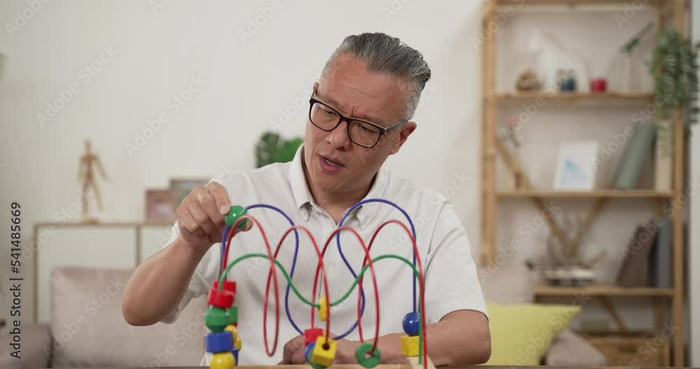portrait of asian elderly male with tremor practicing exercising hand ...