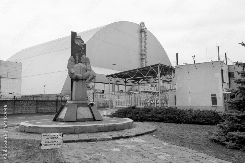 Chernobyl liquidators monument in front of big dome container of 4th ...