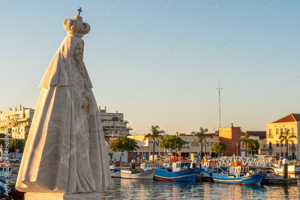 Beautiful sunset at the port of Setubal in Portugal and a statue Stock ...