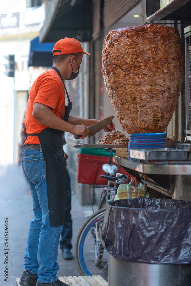 Mexican taquero working doing tacos Stock-Foto | Adobe Stock