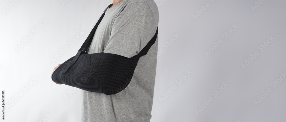 Broken arm. Arm Sling therapy support and covered around elbow first ...