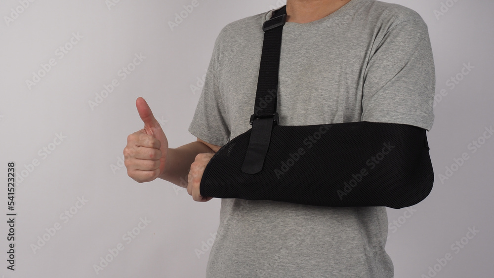 Broken arm. Arm Sling therapy support and covered around elbow first ...