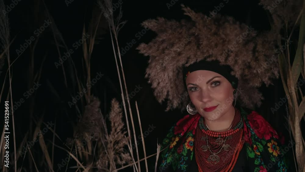 Ukrainian witch - woman in traditional costume with reeds wreath at ...