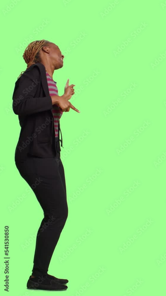 Vertical video: Young positive adult dancing and fooling around ...