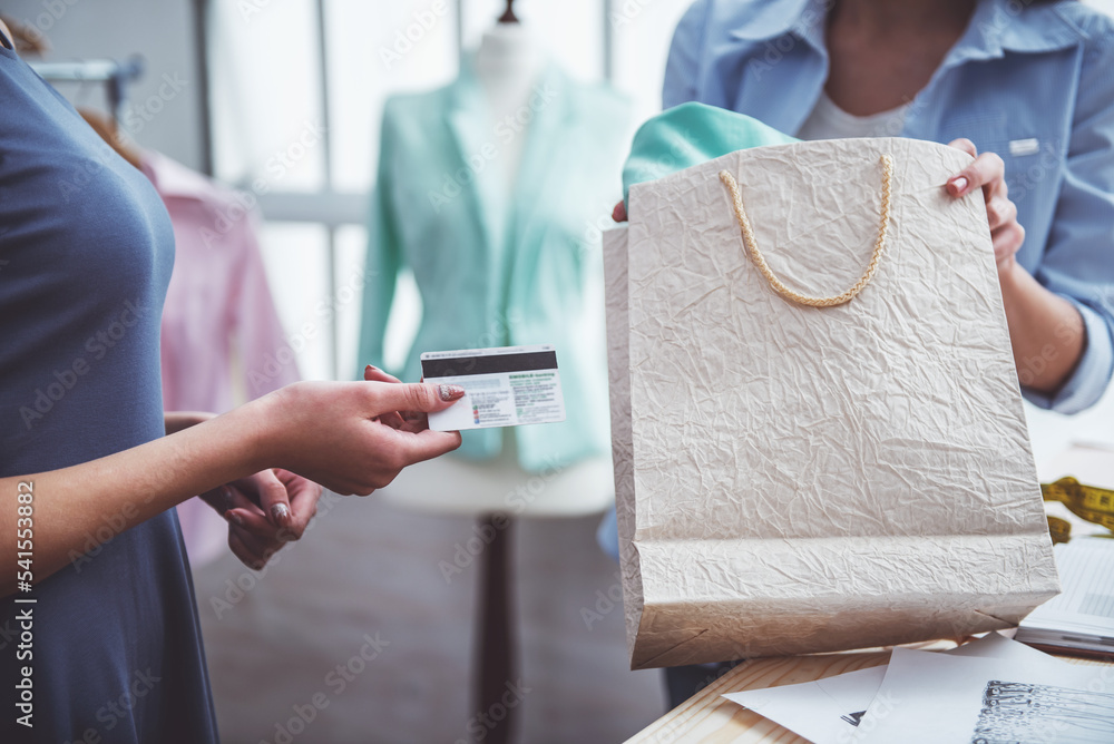 Beautiful young designer and client Stock Photo | Adobe Stock