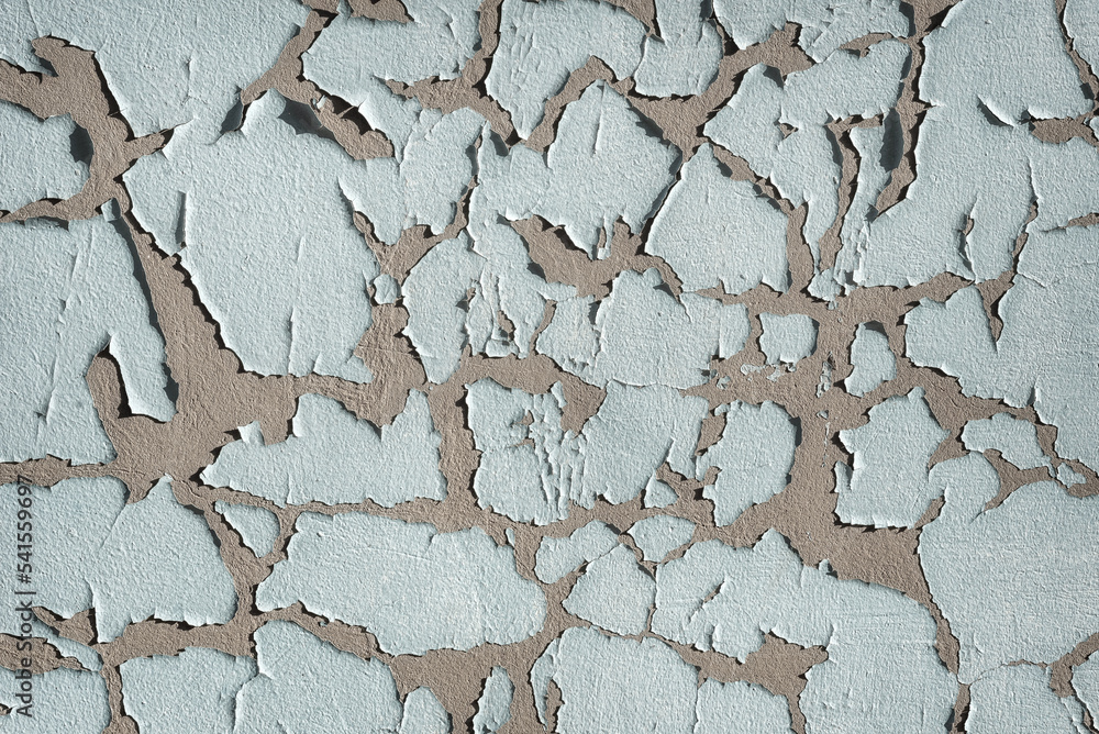 Cracked and peeling gray paint on an old wall. Stock Photo | Adobe Stock