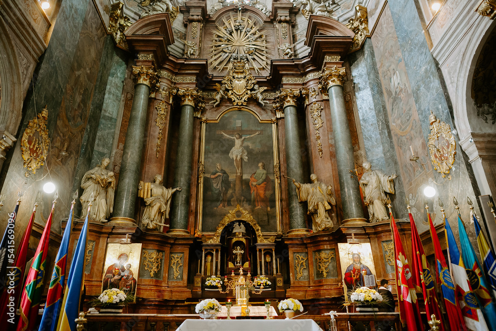 An Interior of a gothic church. Gothic style church interior with flags ...