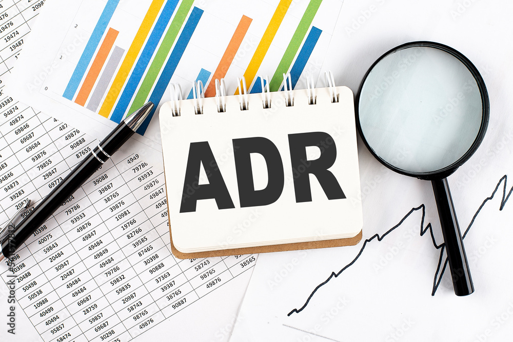 ADR Alternative Dispute Resolution text on notebook on the graph ...