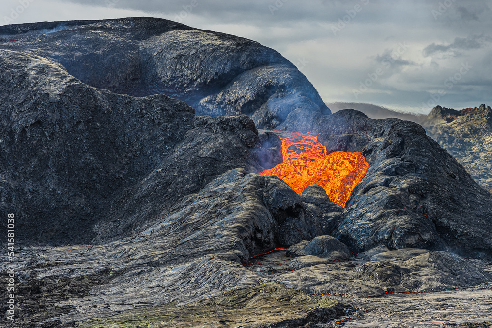 bubbling lava flow from an active volcanic crater. Landscape in Iceland ...