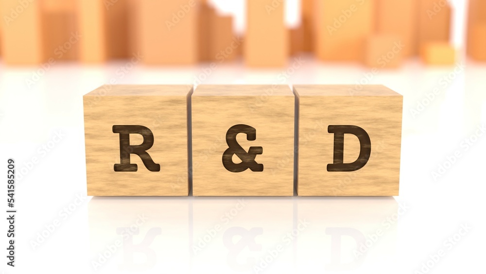 Word R&D branded on wooden cube blocks reflected on the bright surface ...
