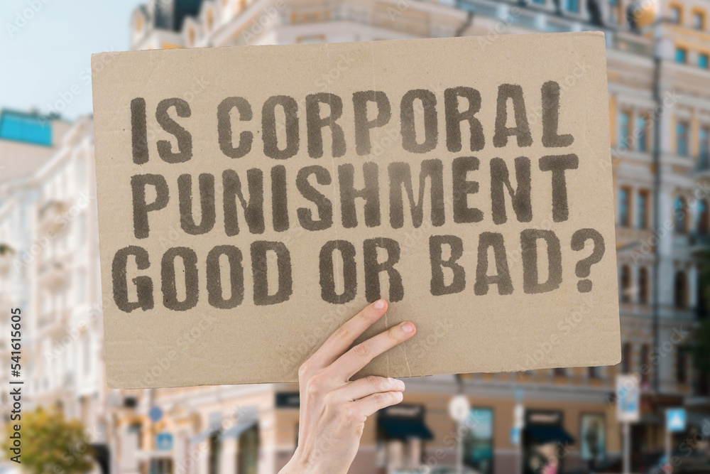 The question " Is corporal punishment good or bad? " is on a banner in ...