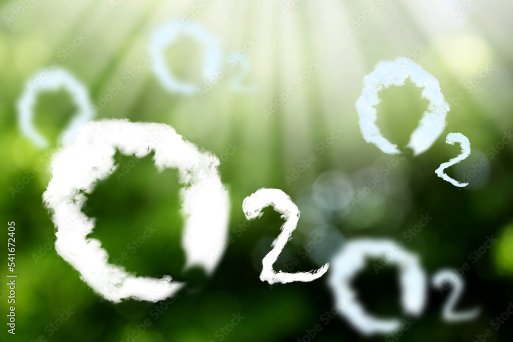 O2 molecules made with clouds and blurred view of green background ...