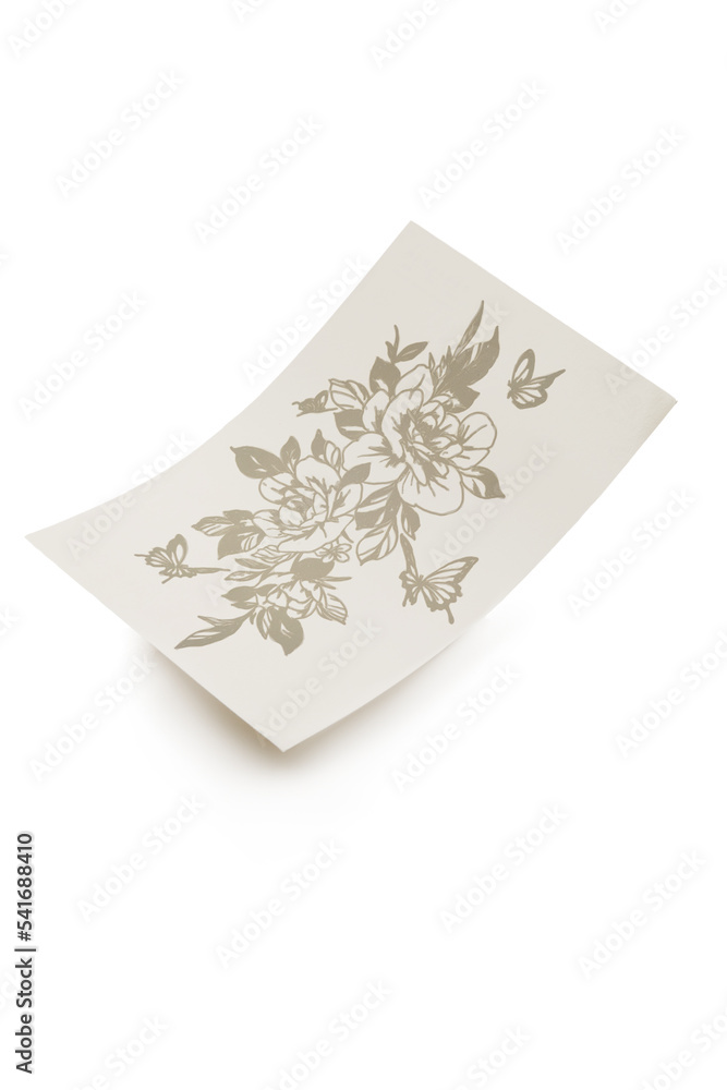 Close-up shot of a sheet of monochrome temporary rose tattoo. The sheet ...